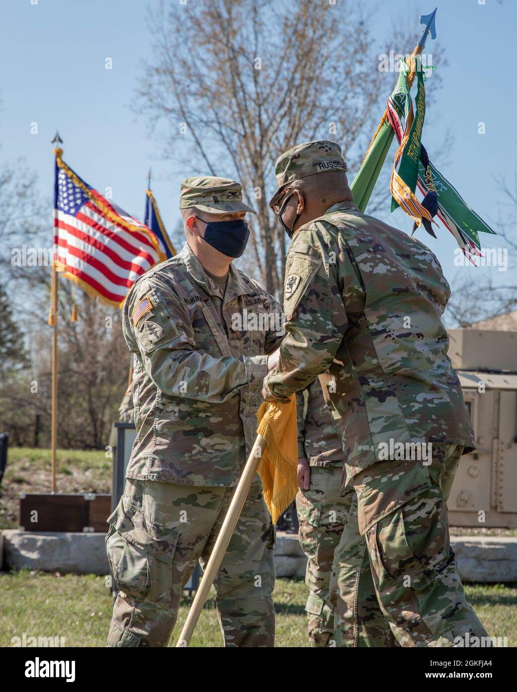 U.S. Army Command Sgt. Maj. William Russell III, outgoing command sergeant major, passes the ...