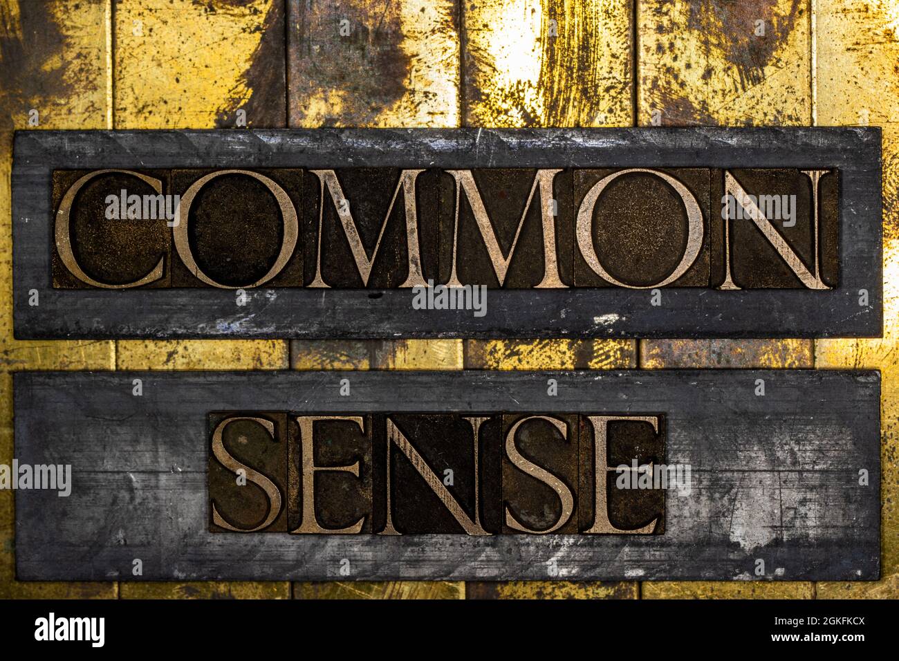Common Sense text message on textured grunge copper and vintage gold ...