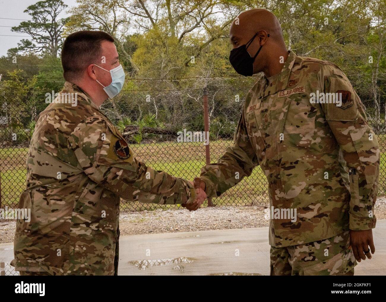 U.S. Air Force Master Sgt. Eric Hartigan, left, 2nd Combat Weather ...