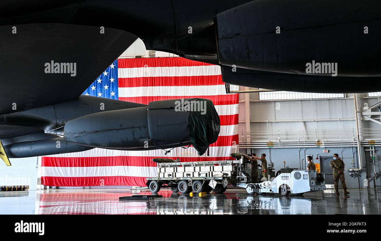 A weapons load team from the 96th Aircraft Maintenance Unit work ...