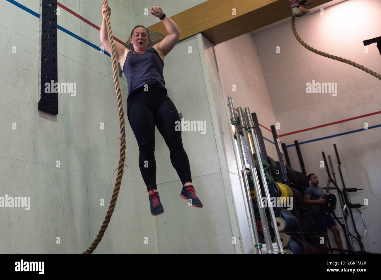 Amber Zebka, Team Osan spouse, descends a rope as part of her ...