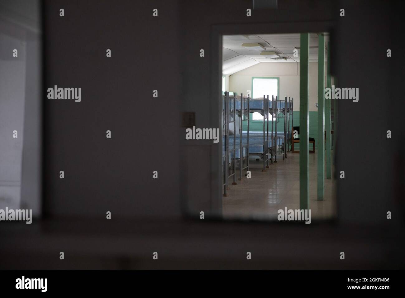 FORT MCCLELLAN, Ala. – A reflection seen in a latrine mirror shows the ...