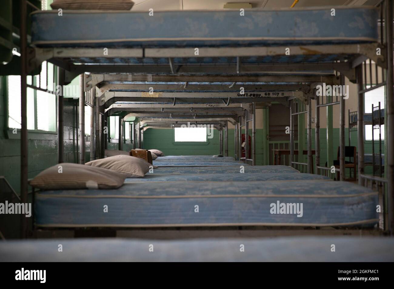 FORT MCCLELLAN, Ala. – Metal bunk beds line the walls of an aging ...