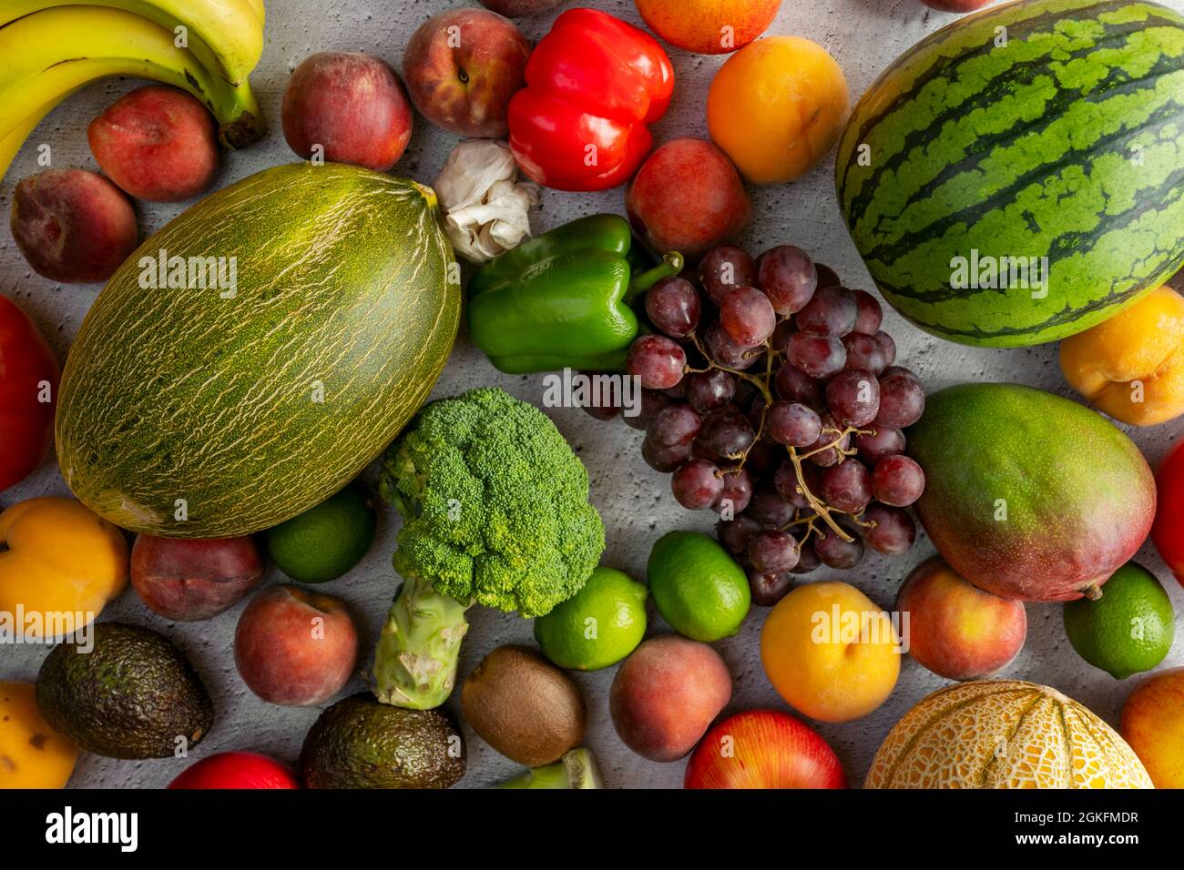 bulk fruits and vegetables. Piel de sapo melon, green broccoli, red watermelon, red grapes ...