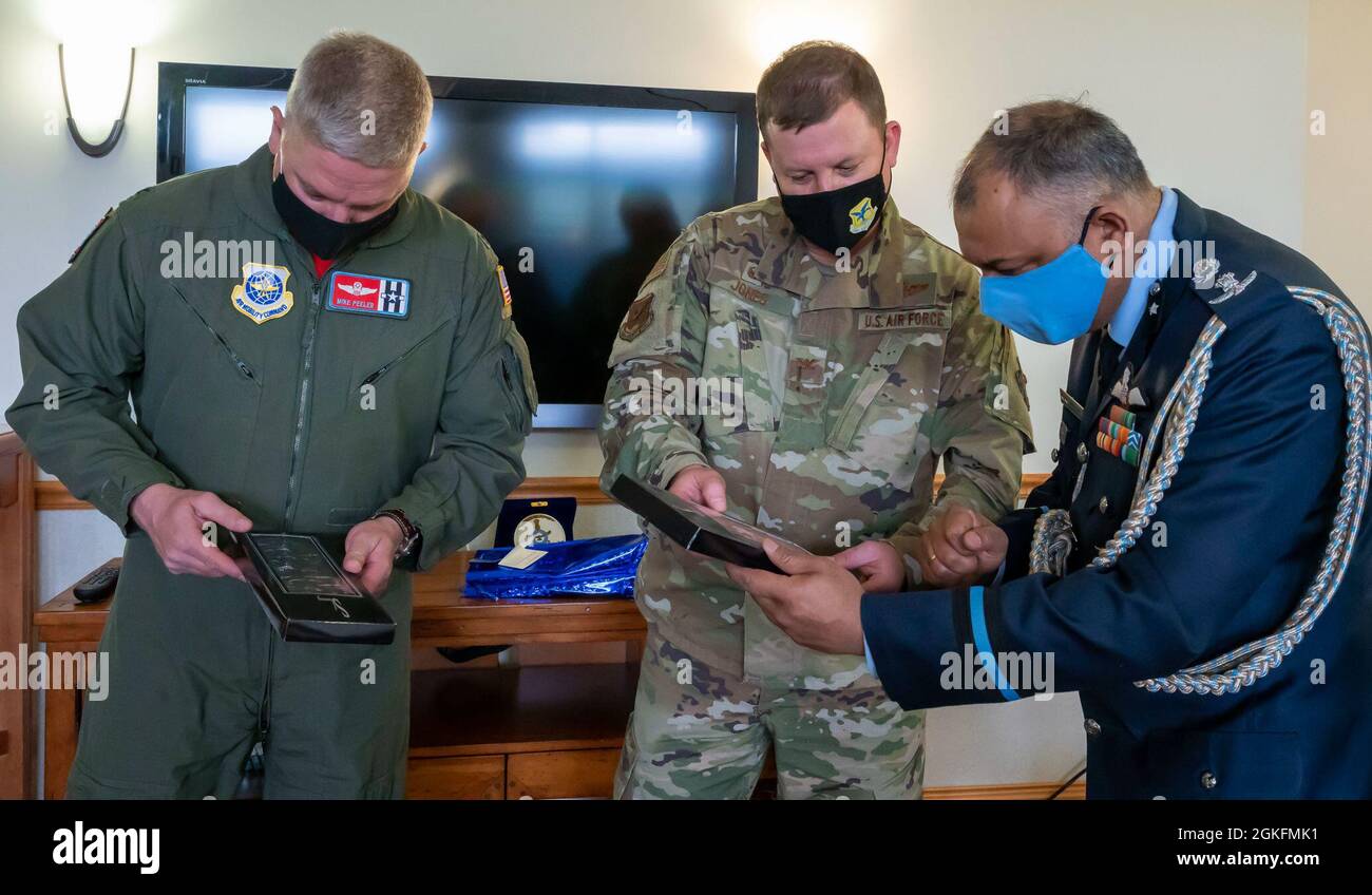 From left, Cols. Michael Peeler, 436th Operations Group commander, and ...