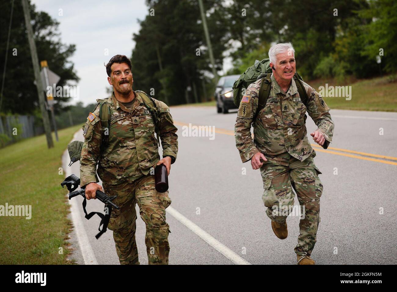 U.S. Army Reserve Sgt. Maj. Jeremy Maddox, right, operations sergeant ...