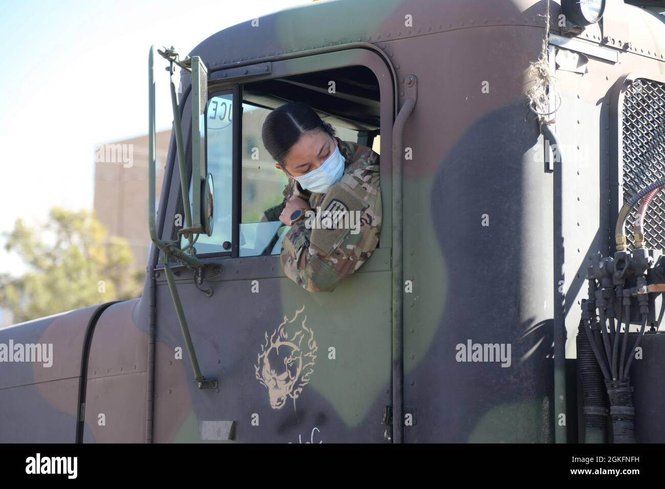A Soldier from the 1115th Transportation Company leans out of the ...