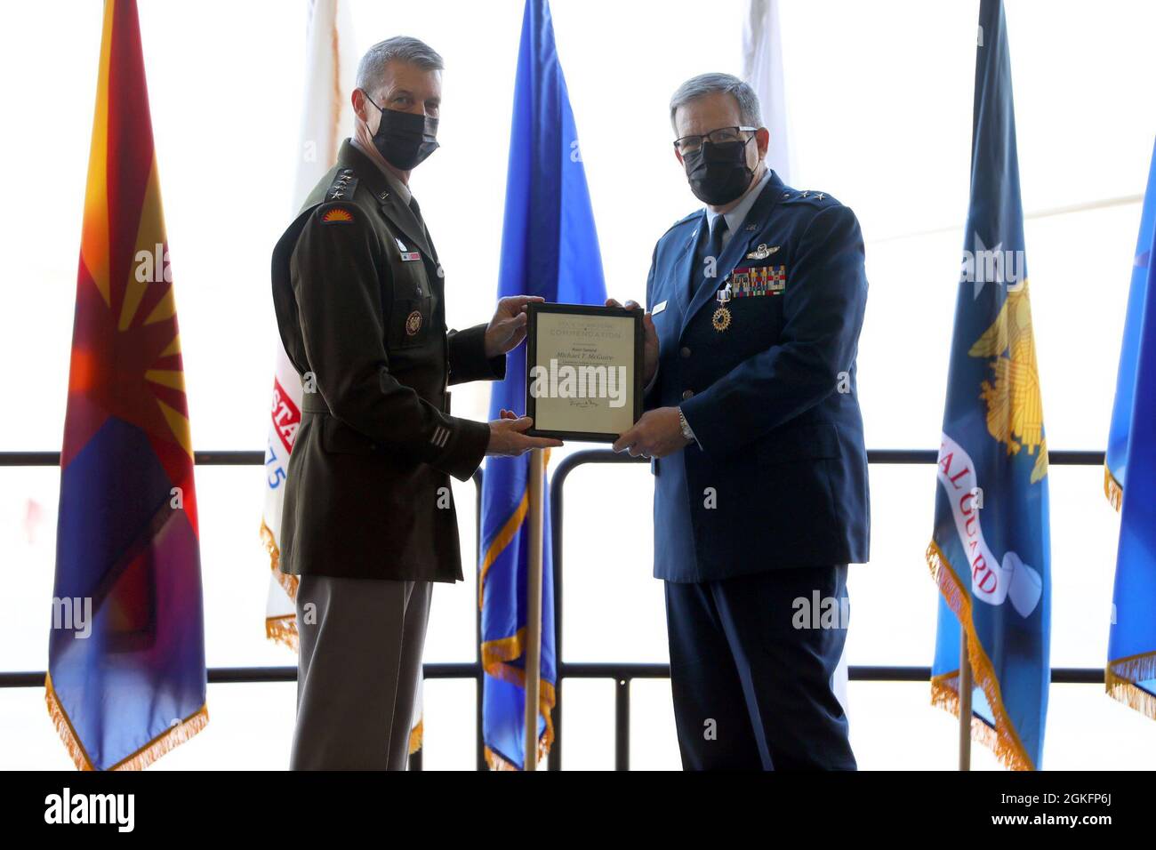 Chief of the National Guard Bureau, General Daniel R. Hokanson presents ...