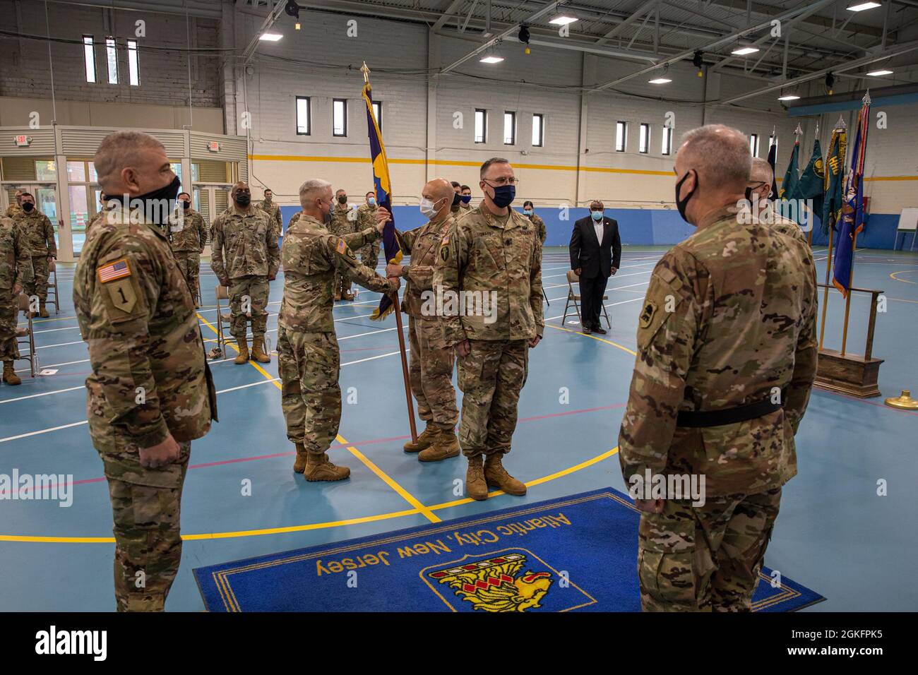 U.S. Army Soldiers, staff of the 57th Troop Command, pass the guidon during a change of command ...