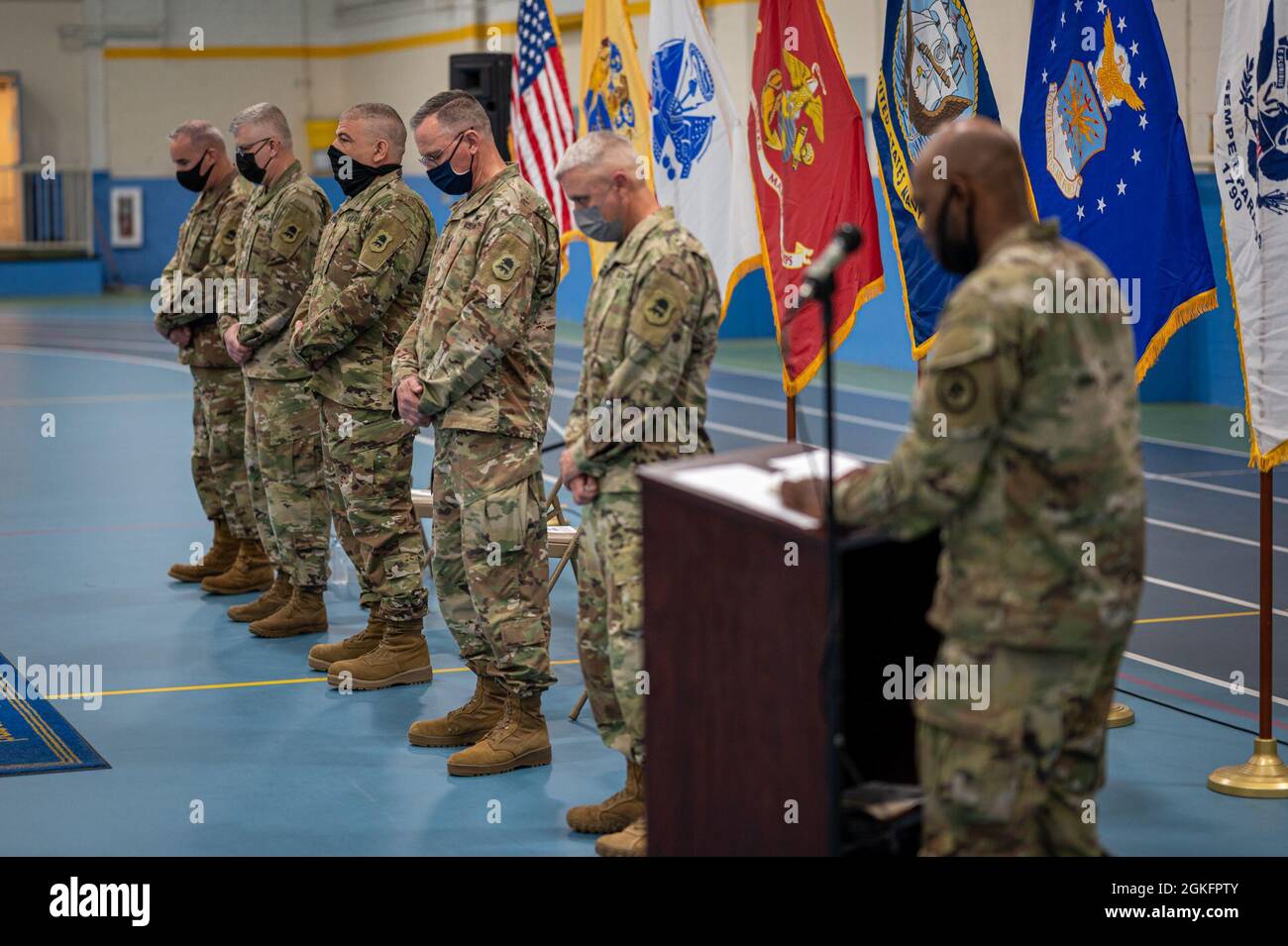 U.S. Army Soldiers, staff of the 57th Troop Command, bow their heads ...