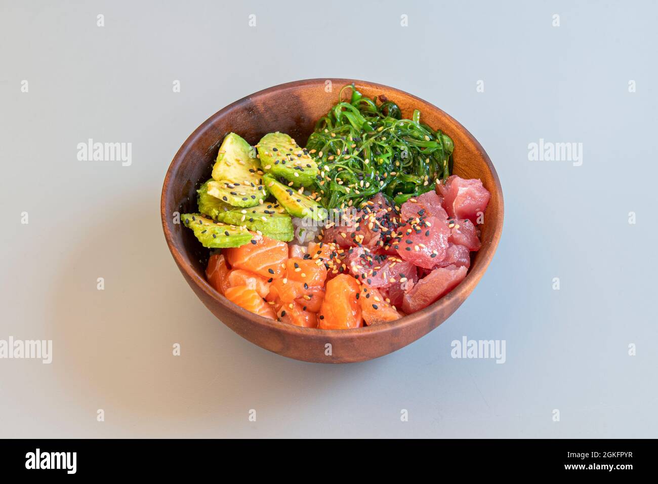 Great mixed poke bowl of marinated salmon and red tuna with ripe ...