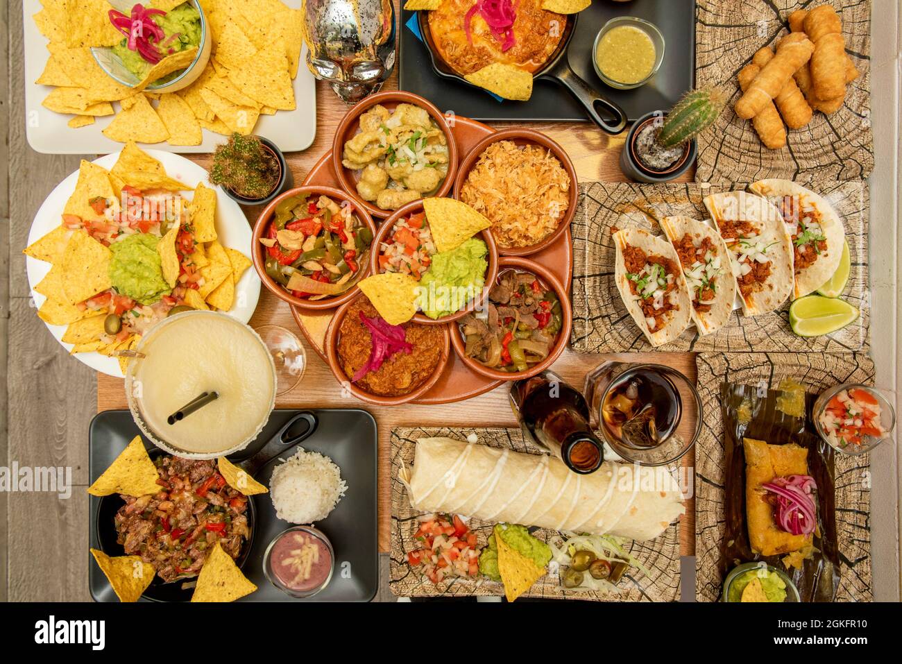 set of mexican dishes with nachos, tacos, quesadillas, wire, tequeños ...