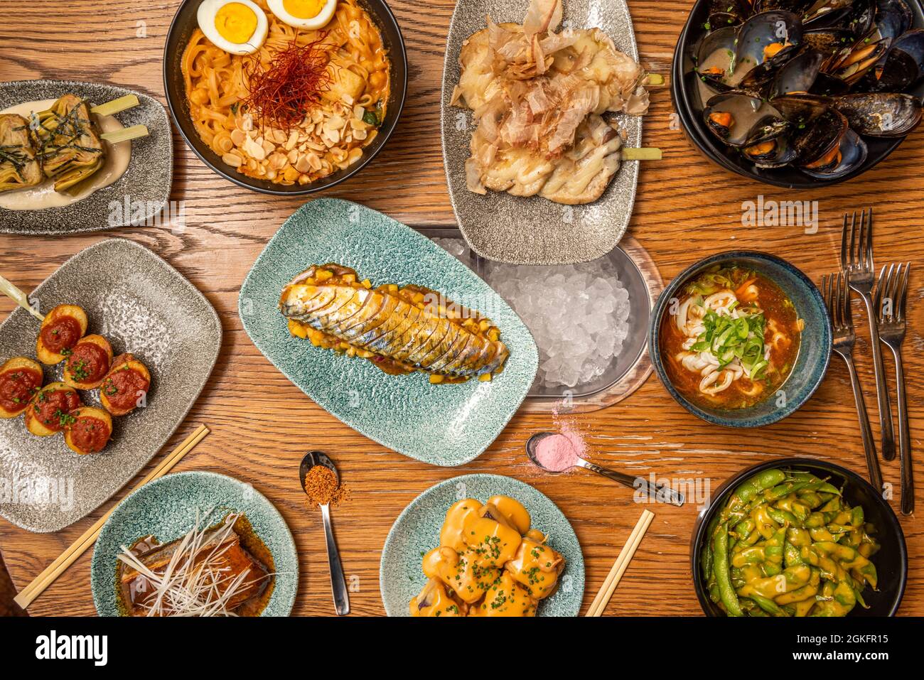 Set of delicious dishes and tapas of Asian Hispanic fusion food with ...