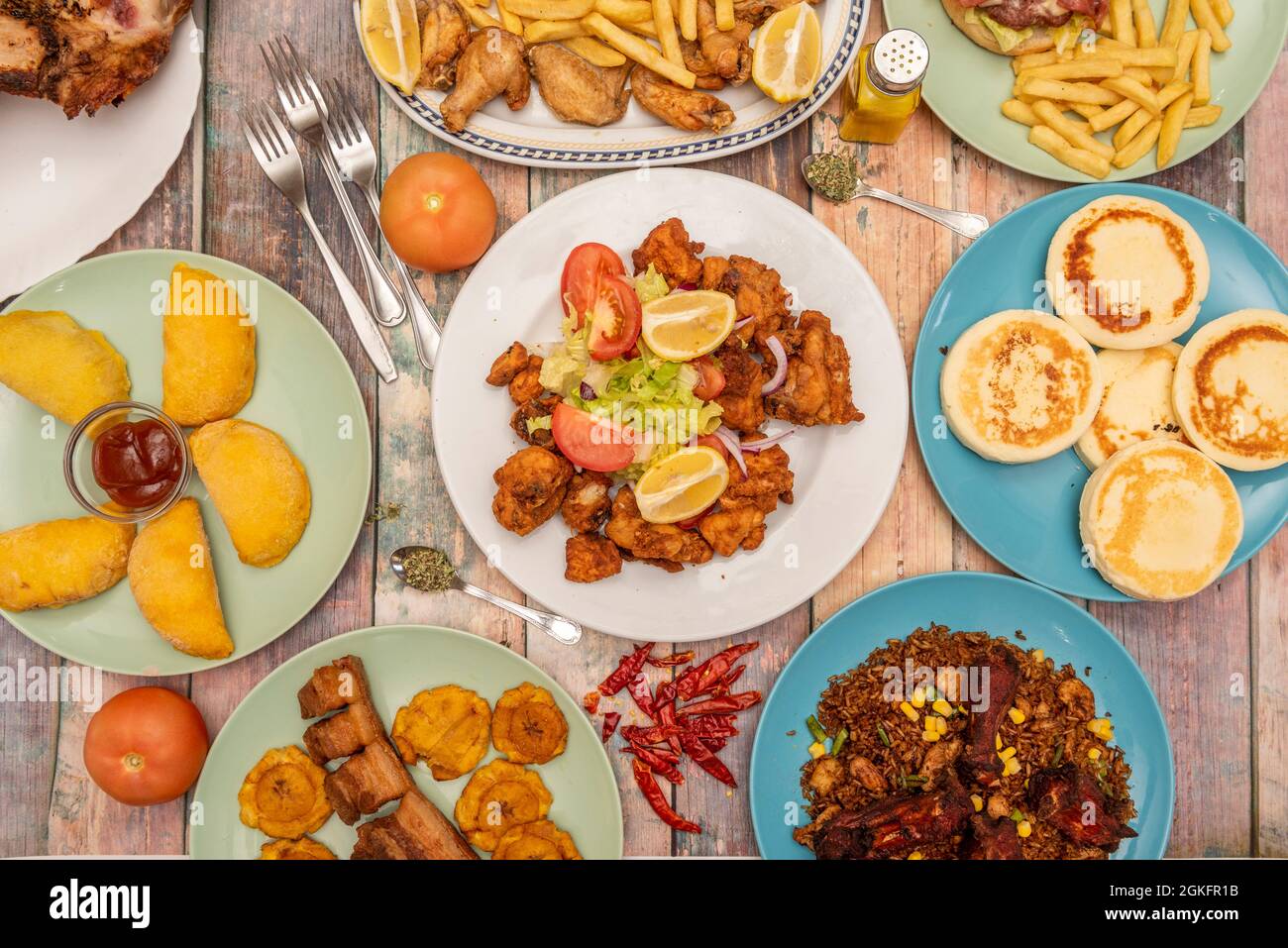 set of assorted dishes of typical Colombian food inside beautiful blue ...