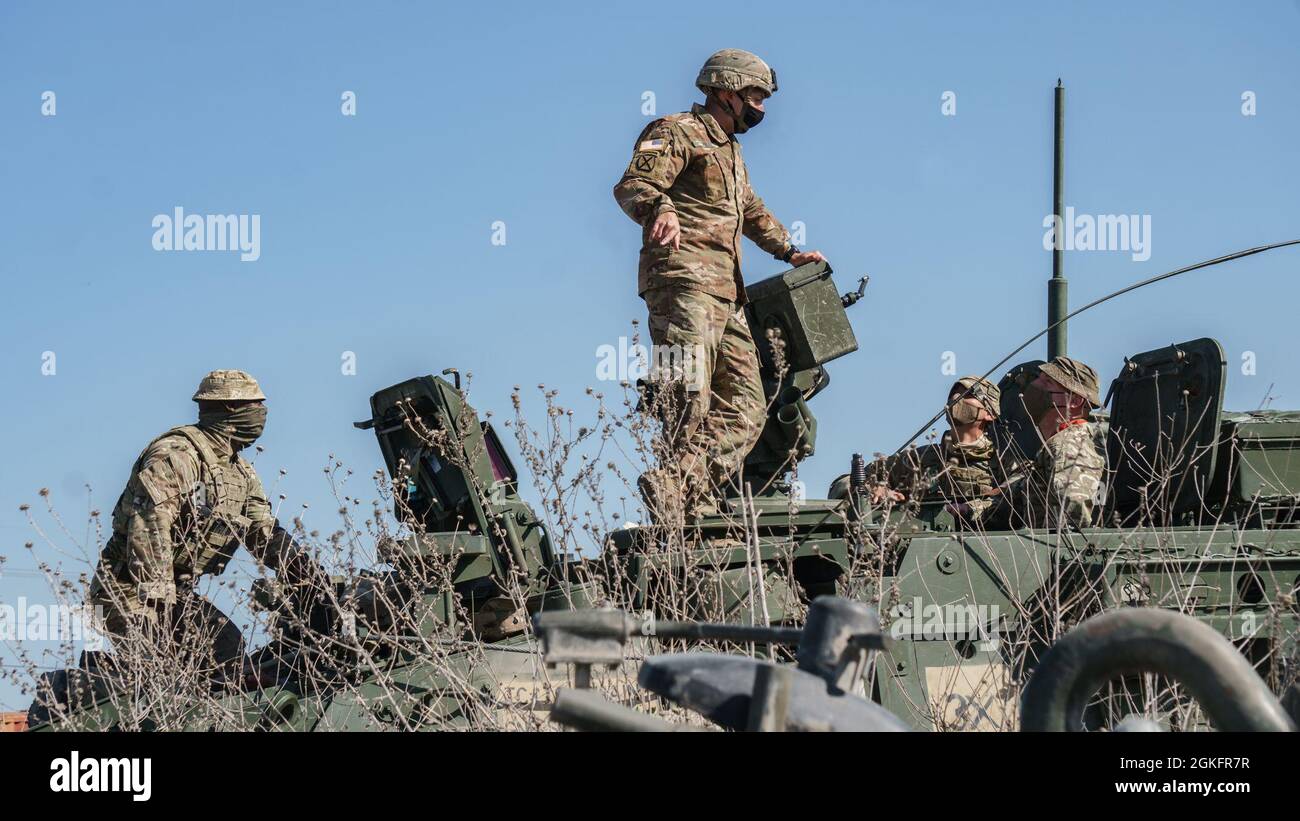 U.S. Army Soldiers from Thunder Squadron, 3rd Cavalry Regiment, give a ...