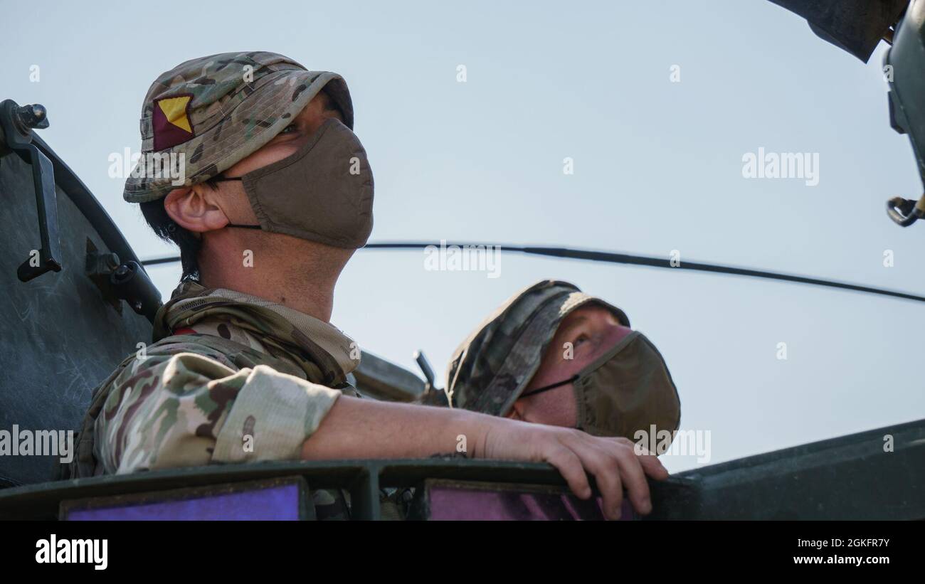 British Army Fusilier Johnson and Taylor, 3rd UK Division, sit atop a ...