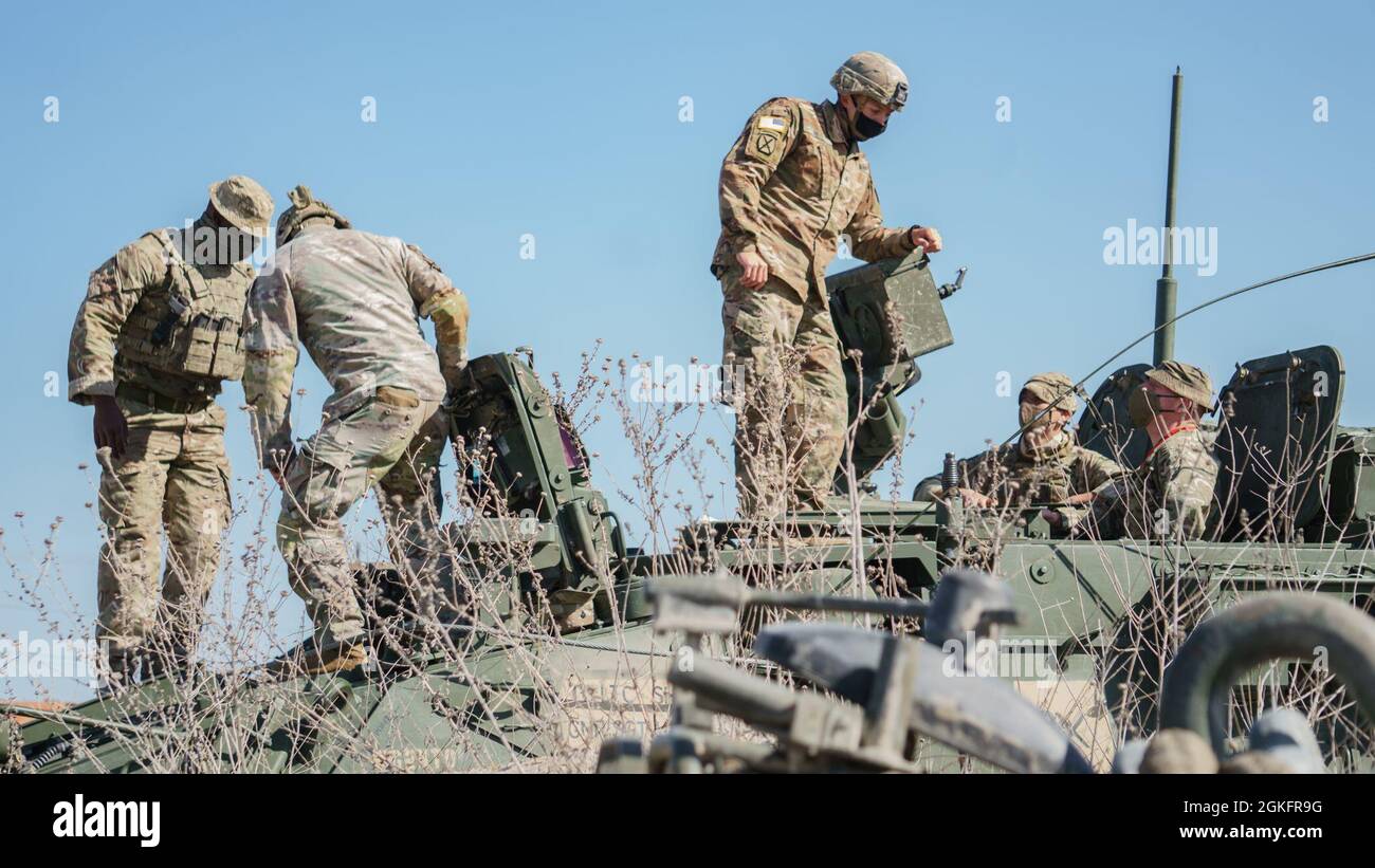 U.S. Army Soldiers from Thunder Squadron, 3rd Cavalry Regiment, give a ...