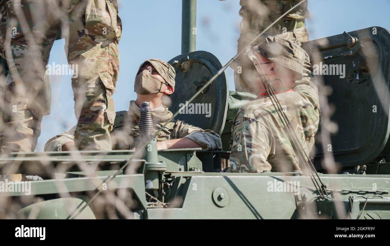 British Army Fusilier Johnson and Taylor, 3rd UK Division, sit atop a ...