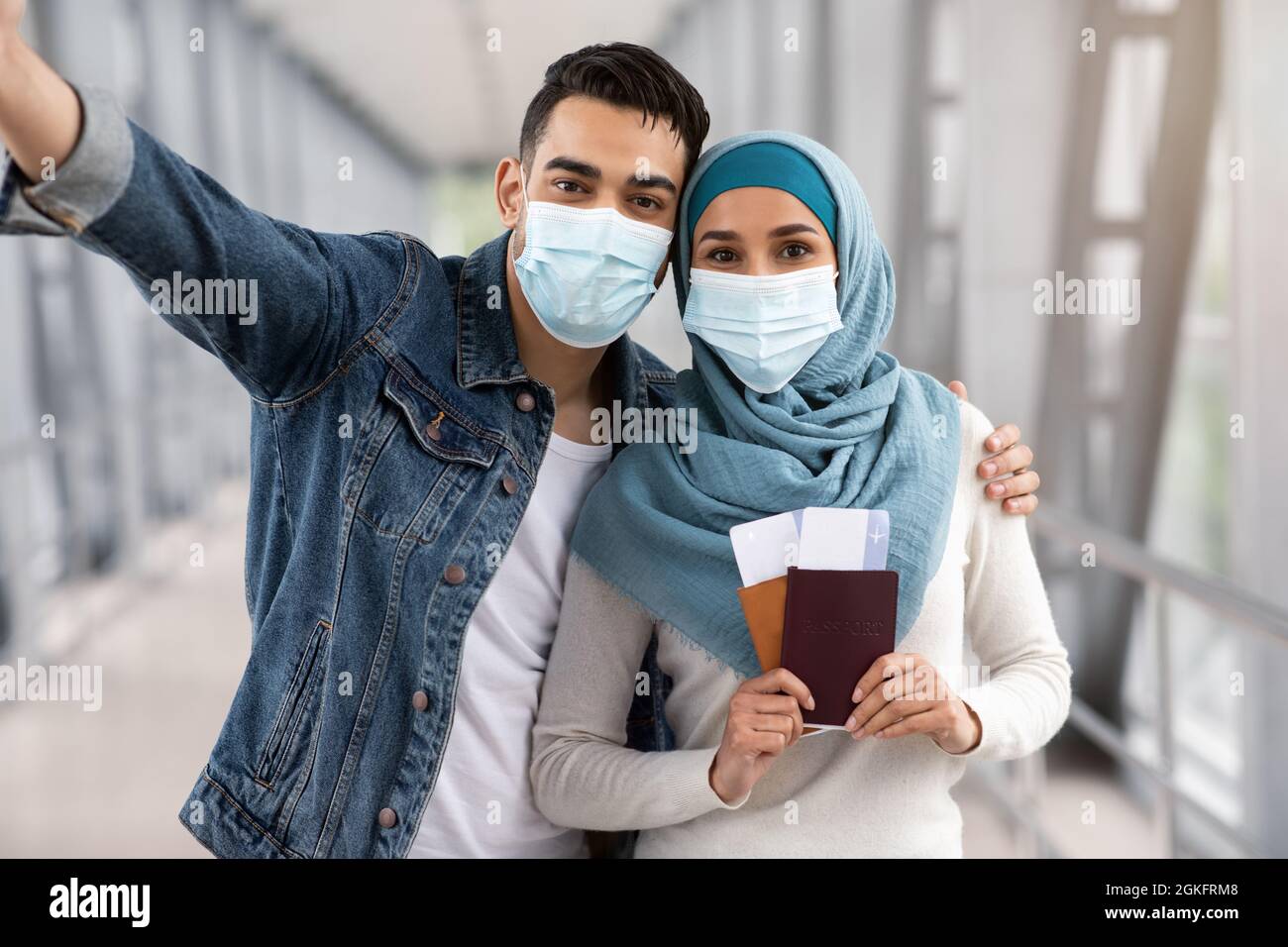 Happy Islamic Spouses In Medical Face Masks Taking Selfie In Airport ...