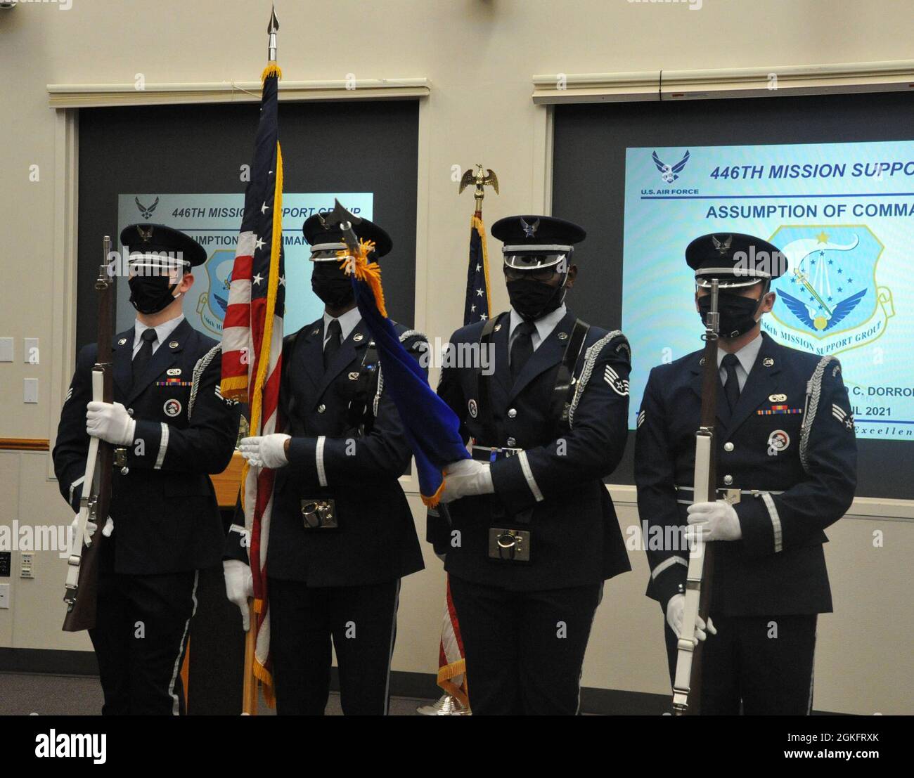 U.S. Air Force color guard presents arms during the national anthem at ...