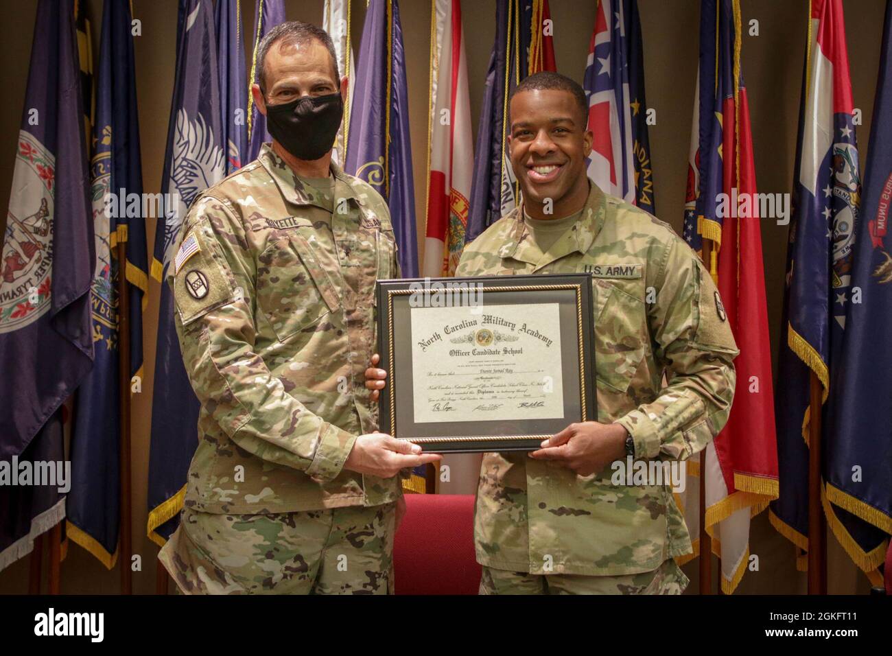 Officer Candidate Dante Ray receives a diploma from Brig. Gen. Robert ...