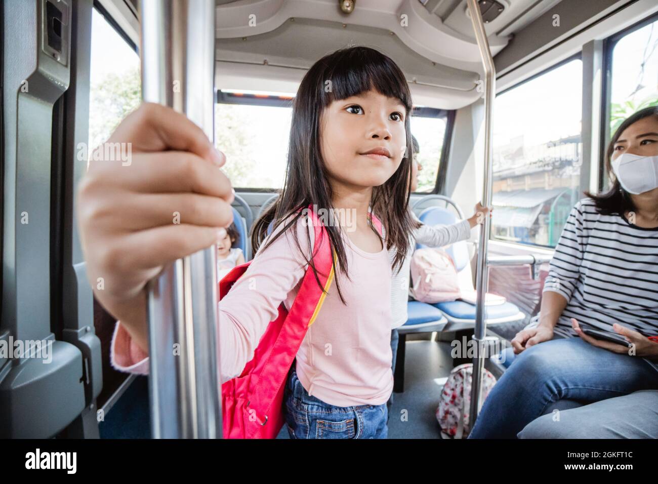 kid going to school in the morning by public transport Stock Photo - Alamy