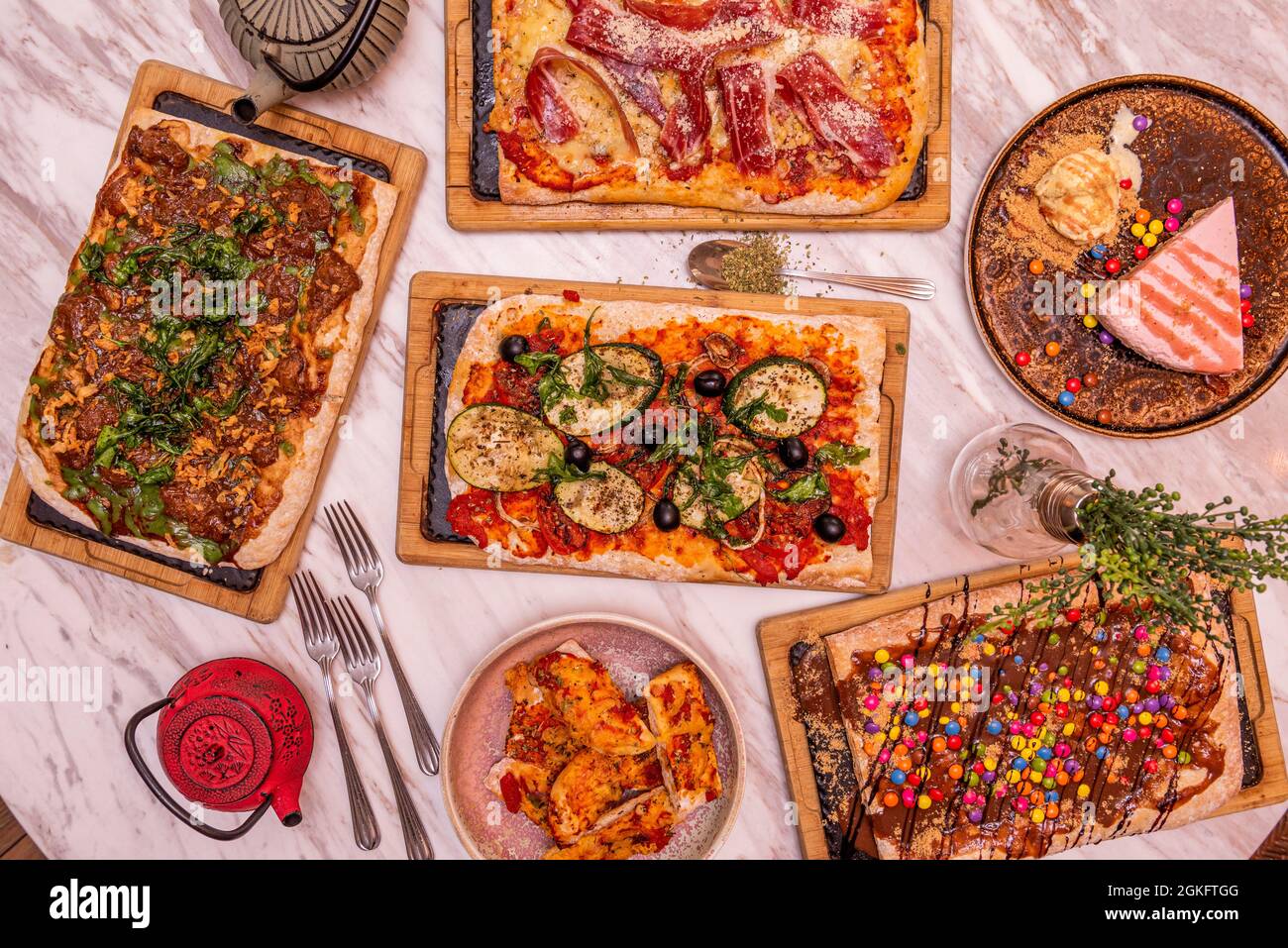 Sweet and savory rectangular pizzas. Pizza with serrano ham and cheese ...