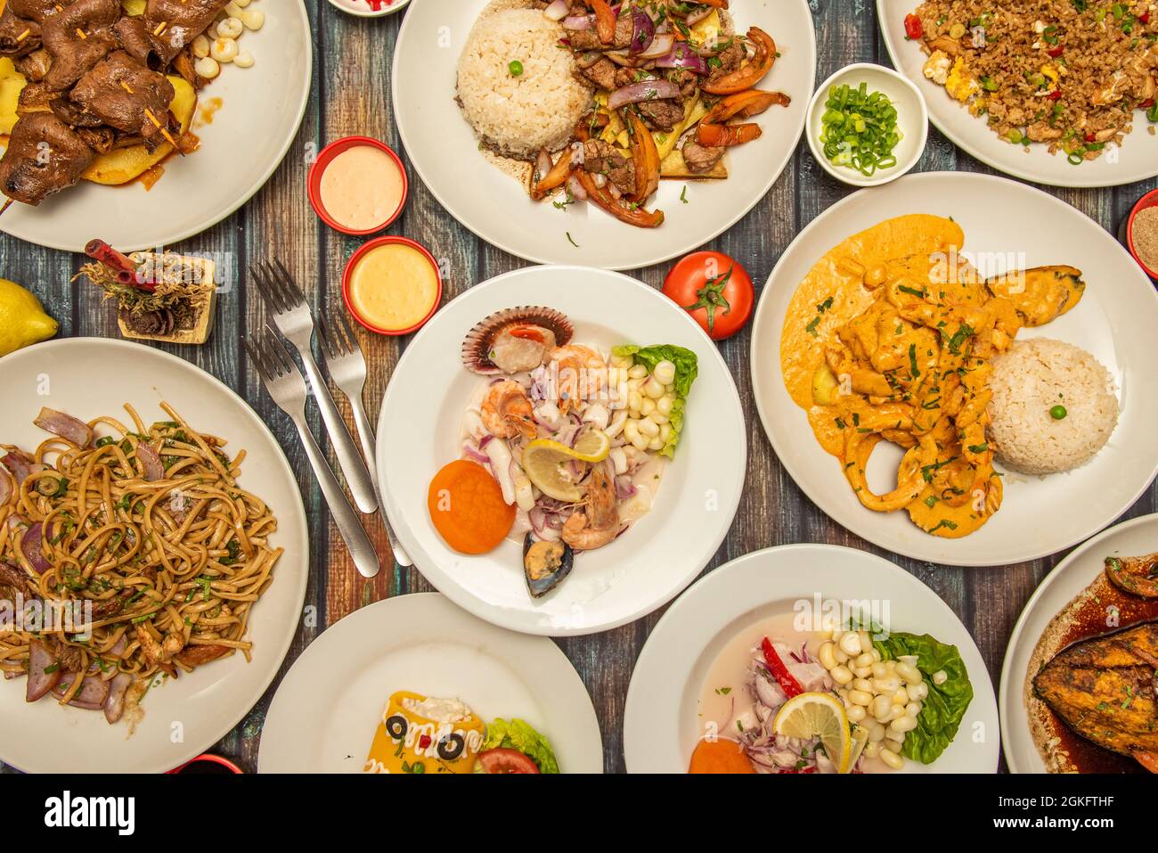 dishes of typical Peruvian restaurant food. Ceviches, lomo saltado ...