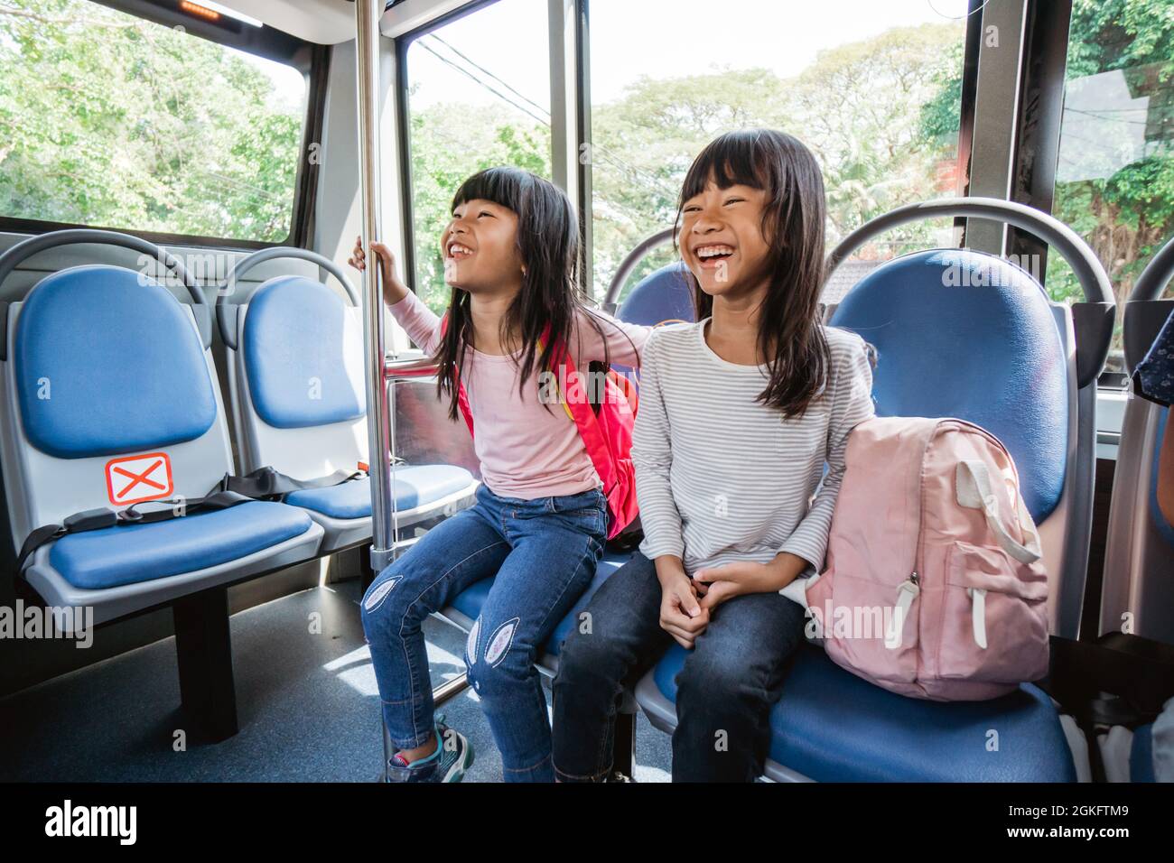primary student going to school by bus public transportation together ...