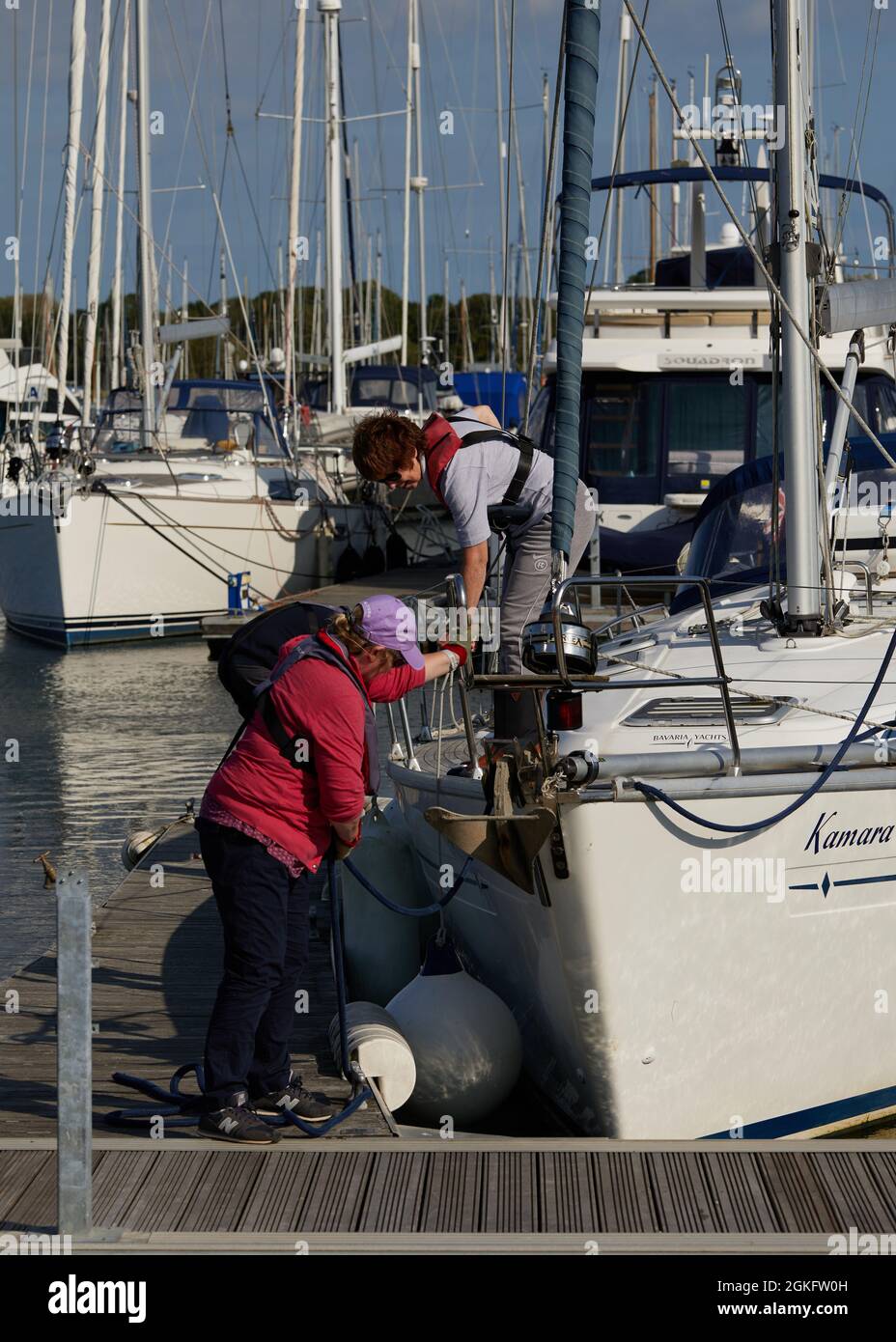 Yachtswomen at work on the boat Stock Photo - Alamy