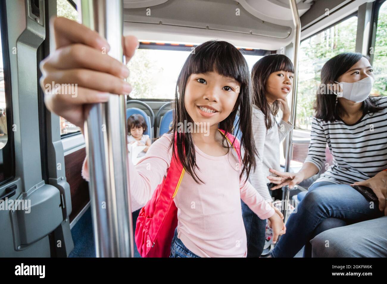 kid going to school in the morning by public transport Stock Photo - Alamy