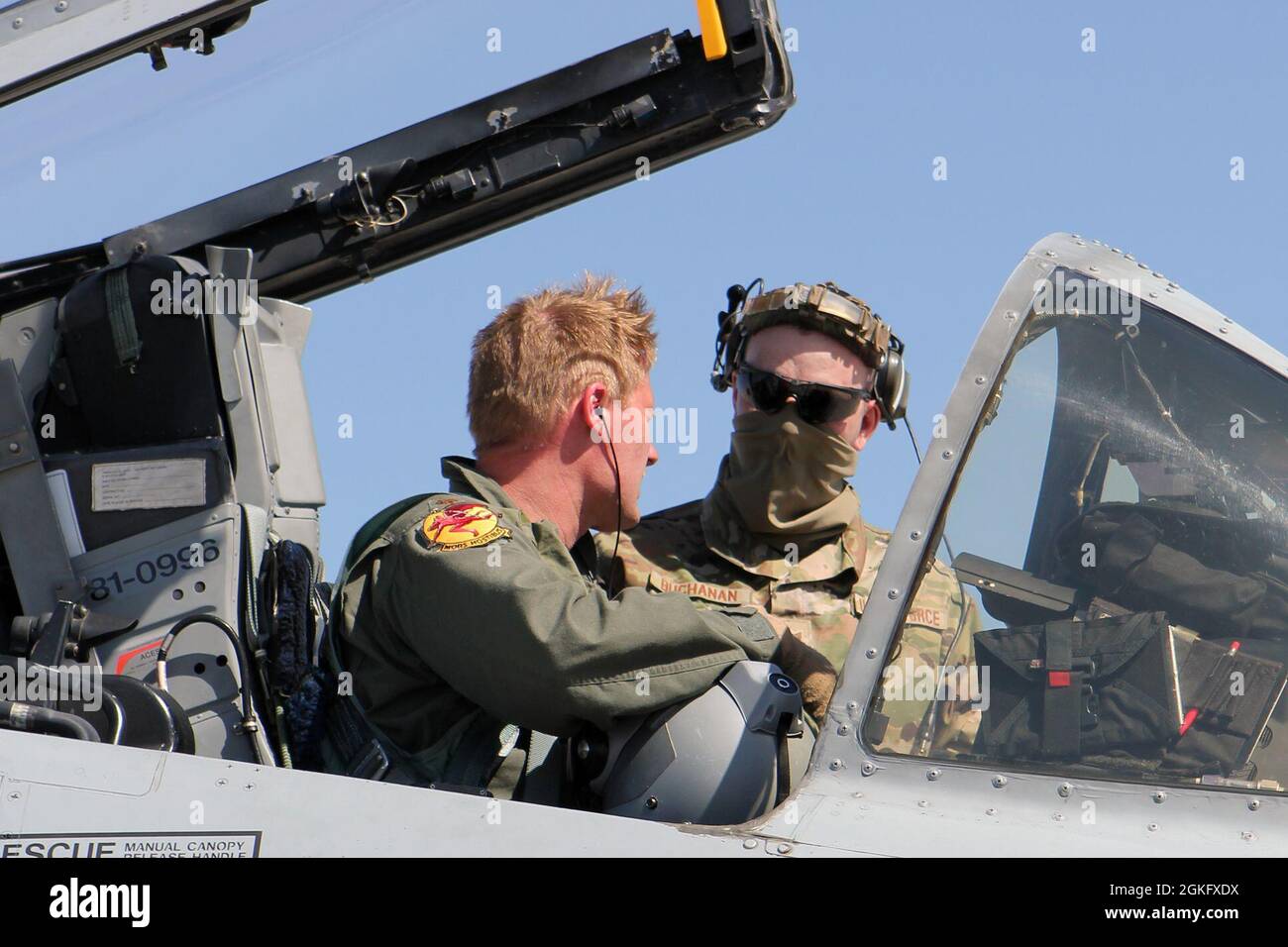 Pilot Major Andrew Axe and crew chief Airman 1st Class Dakota Buchanon ...