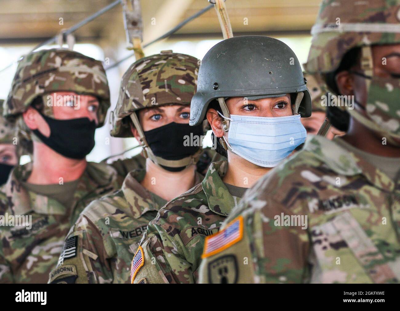 Paratroopers from the 82nd Airborne Division prepare to for their jump ...