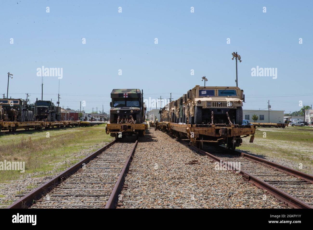 U.S. Marines stage tactical vehicles on rail cars during exercise ...