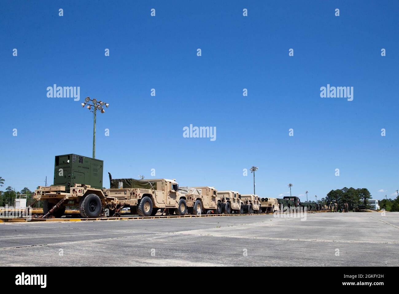 U.S. Marines stage tactical vehicles on rail cars during exercise ...