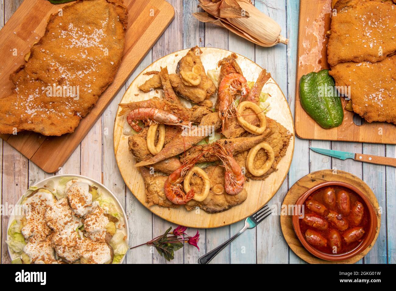 Plates of popular Spanish food in tapas restaurant. Hell chorizos ...