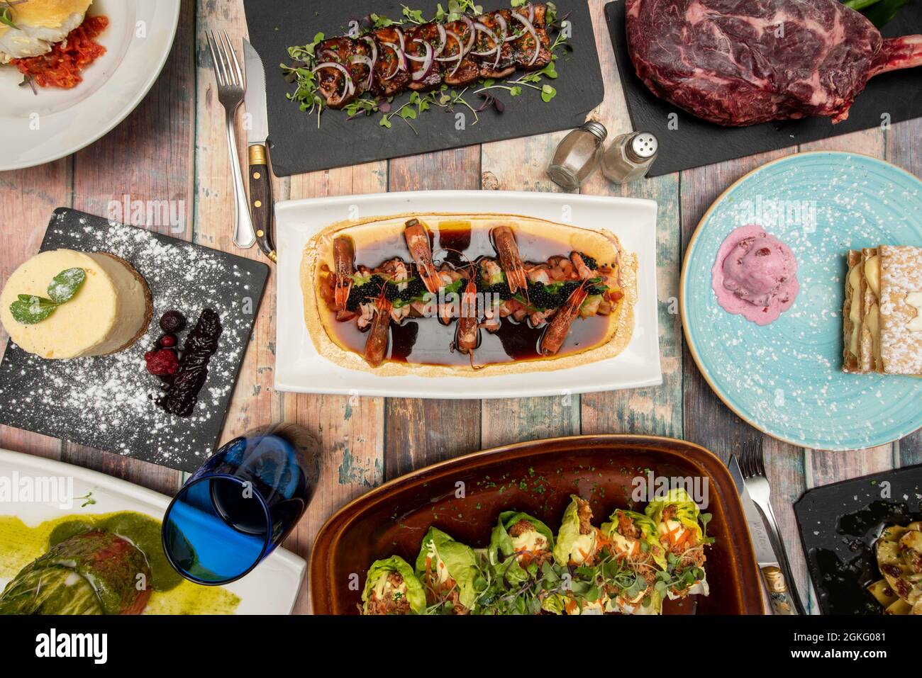 Set of dishes and desserts of Spanish food. cheesecake, cream mille ...
