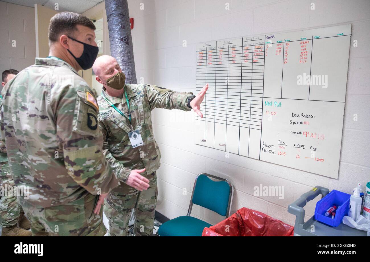 U.S. Army Lt. Col. Jonathan Lindsley, right, explains vaccination ...