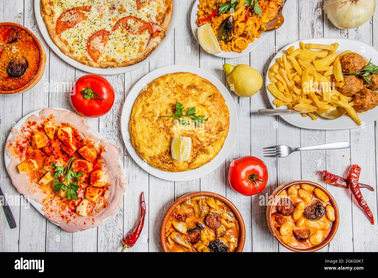 Spanish food dishes set. Seafood paella, Madrid-style tripe, cooked ...