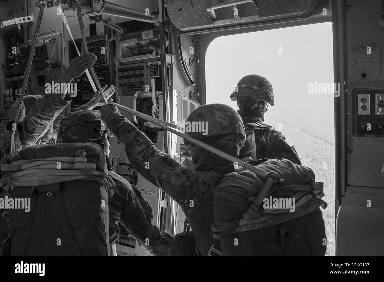 Paratroopers from the 82nd Airborne Division prepares to jump into ...