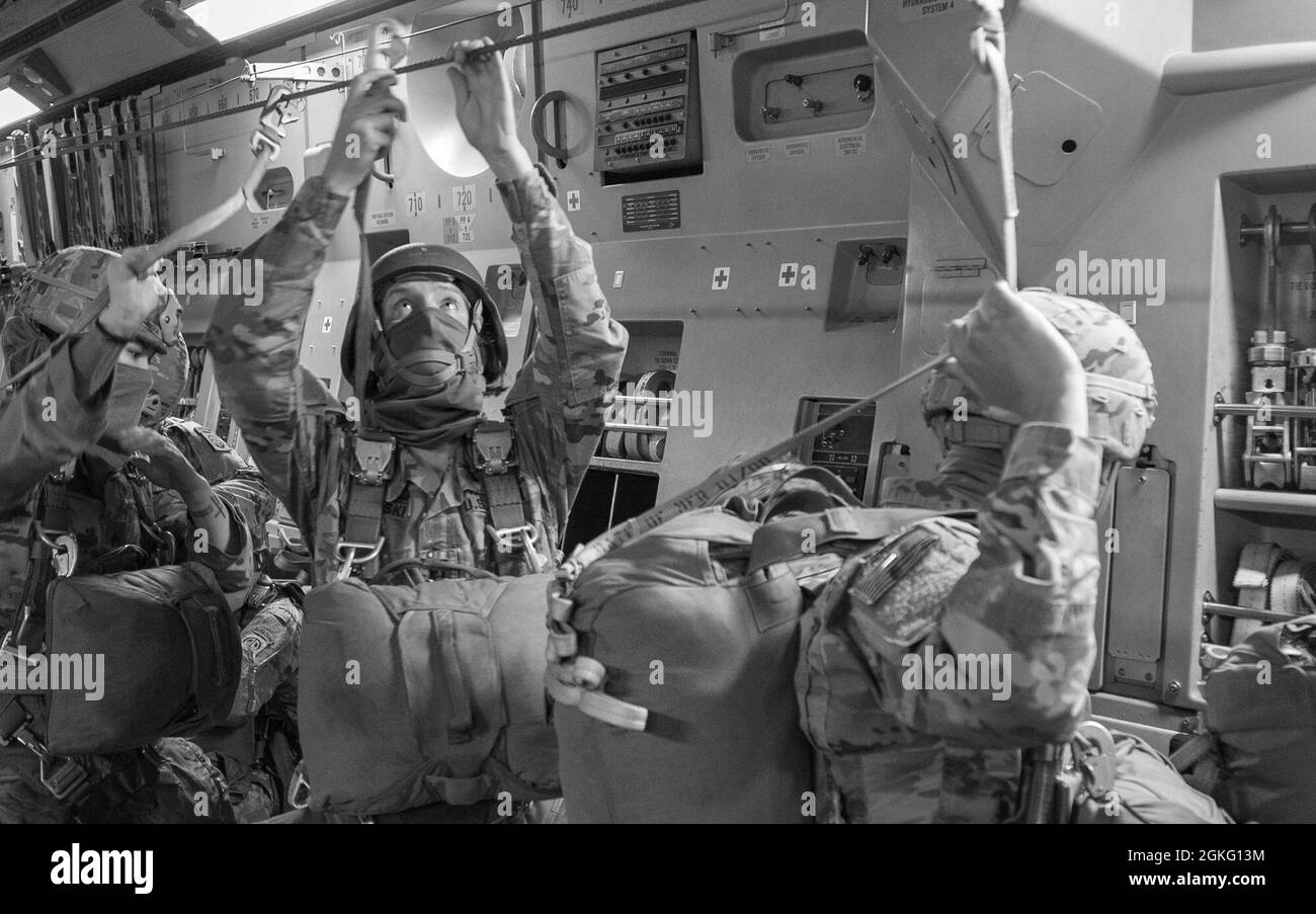 Paratroopers from the 82nd Airborne Division prepare to for their jump ...