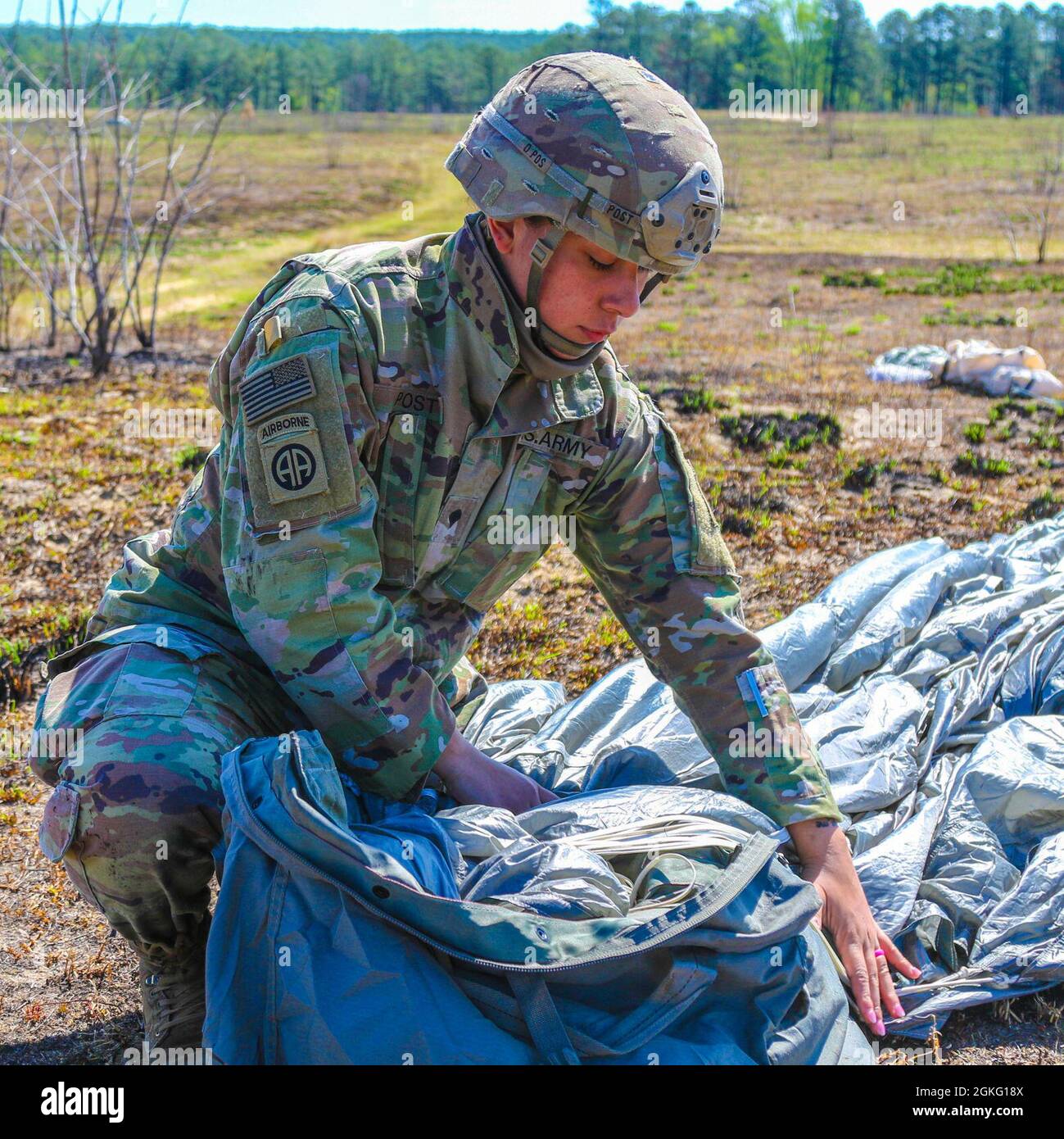 A female Paratrooper from the 82nd Airborne Division packs her T-11 ...