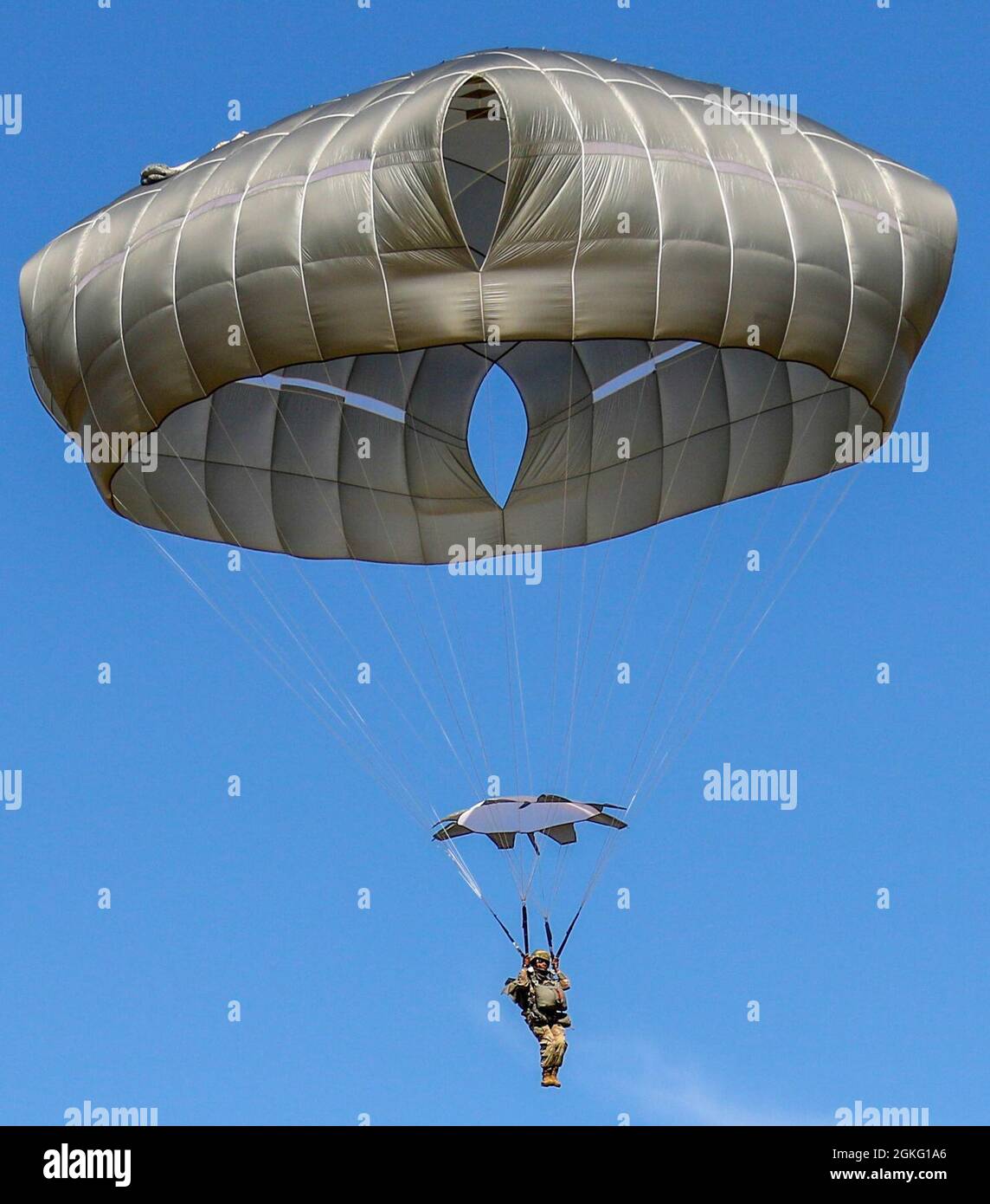 A female Paratrooper from the 82nd Airborne Division drops towards ...