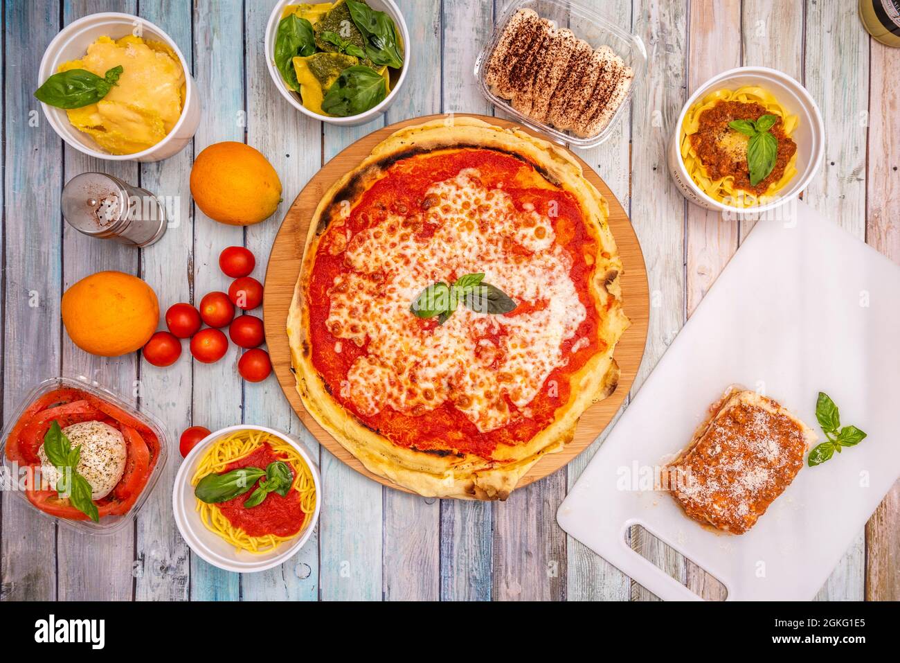 Top view image of typical Italian dishes with lots of basil, margarita ...