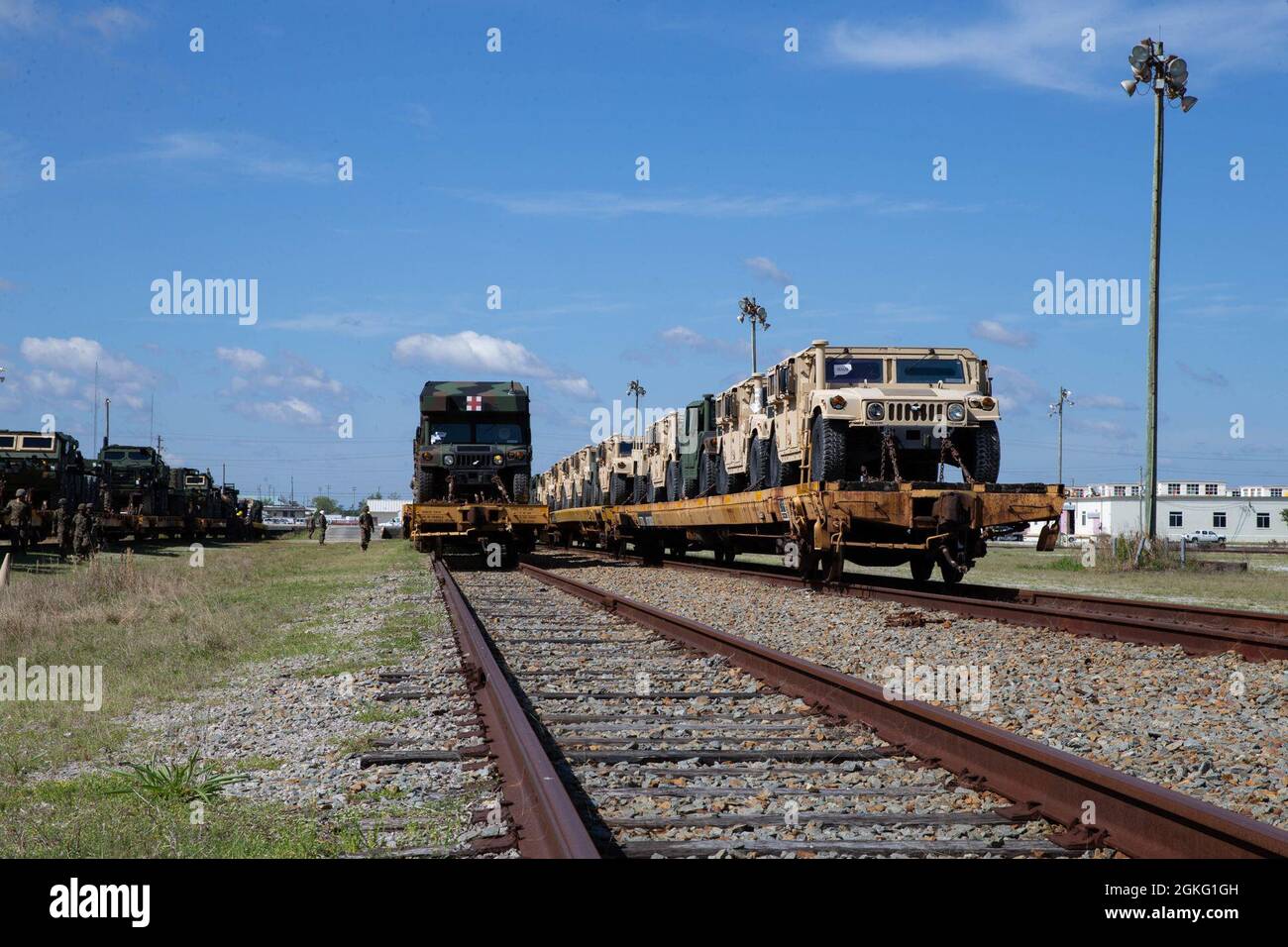 U.S. Marines stage tactical vehicles on rail cars during exercise ...