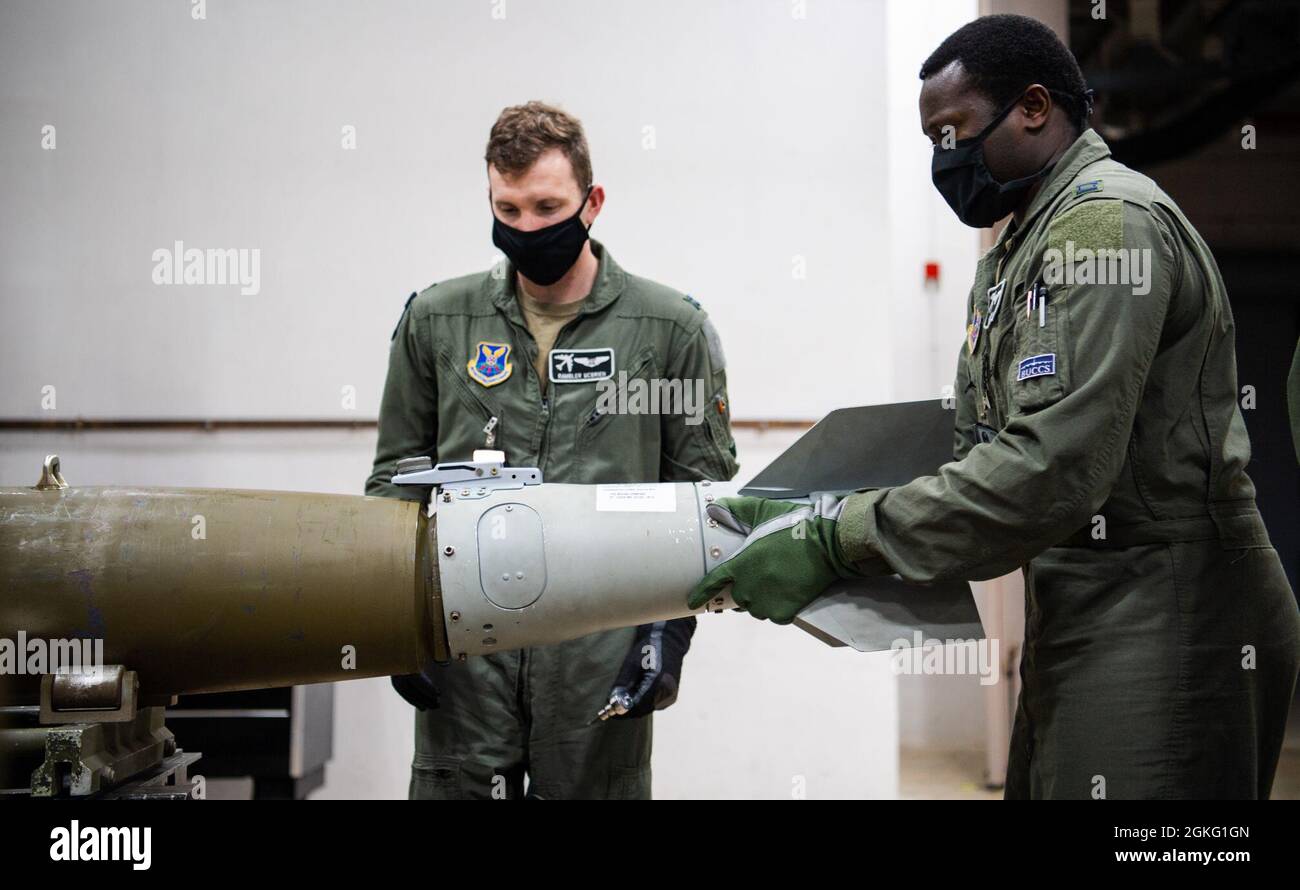 Capts. Michael McBrien and Joseph Okai, 340th Weapons Squadron weapon ...
