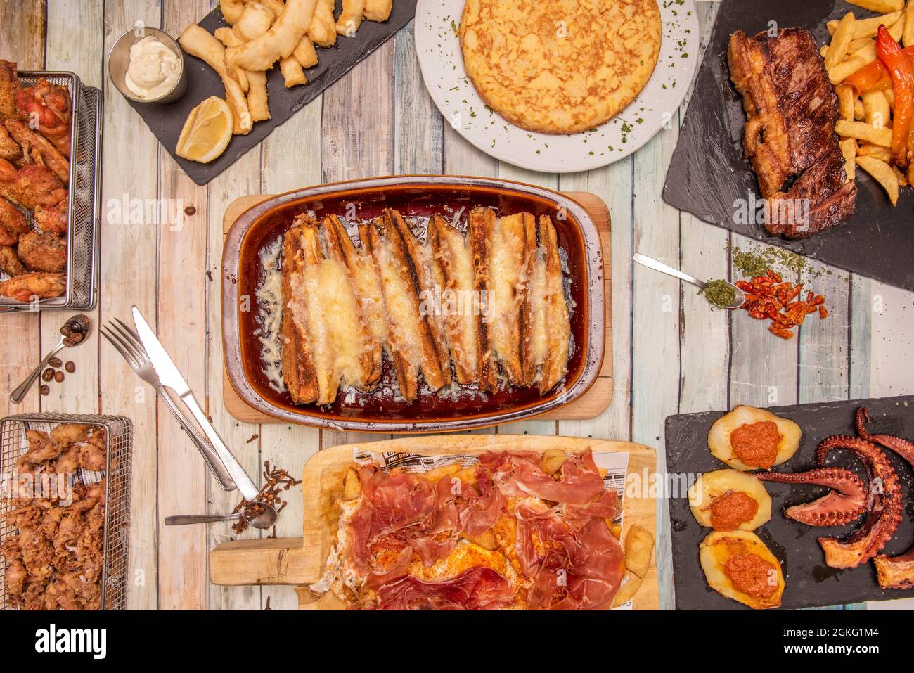 Popular Spanish tapas dishes served in a restaurant. puntillitas ...