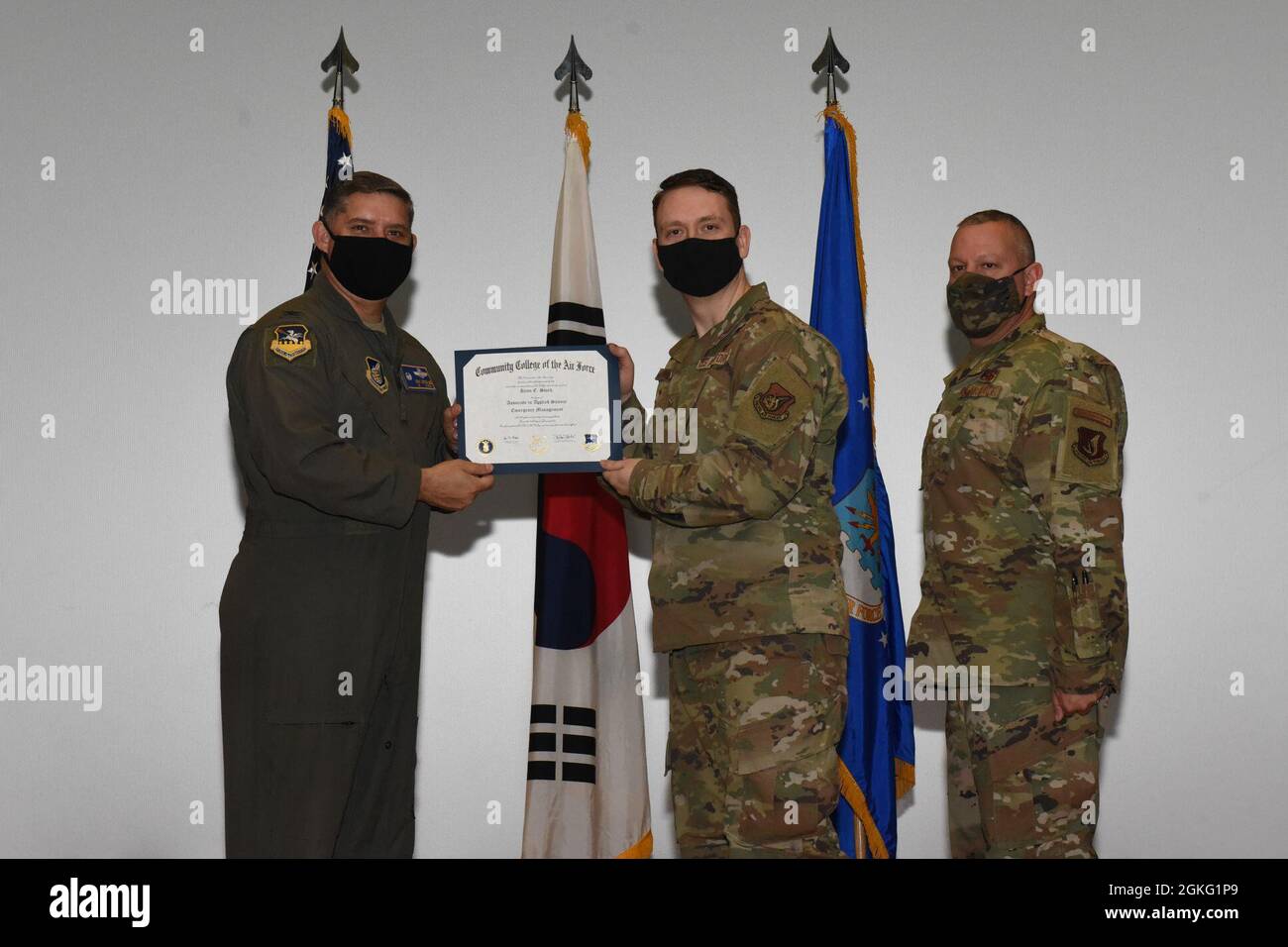 Tech. Sgt. Ryan Stork, 51st Civil Engineering Squadron, receives his ...