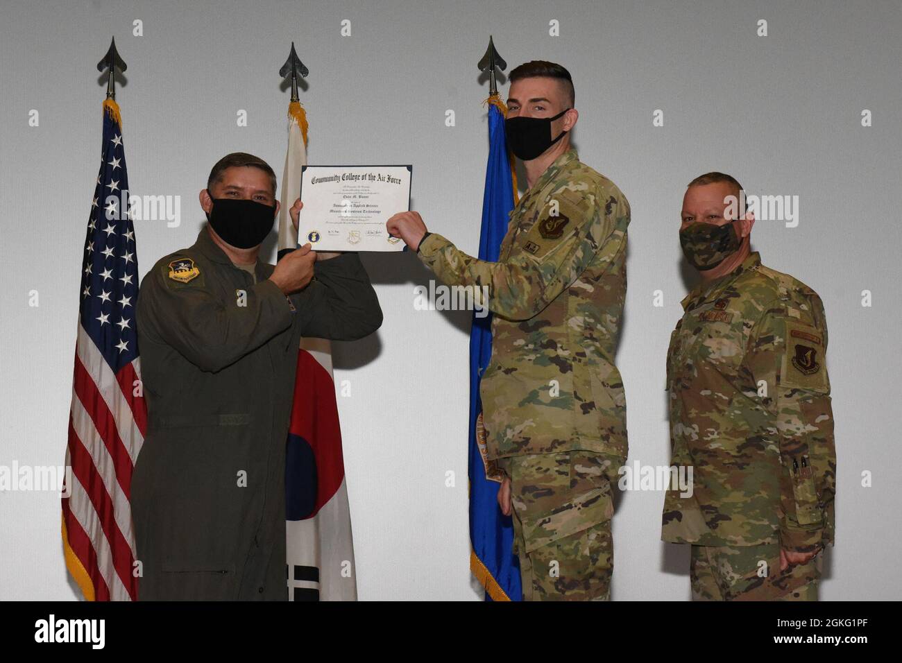 Staff Sgt. Evan Boone, 51st Munitions Squadron, receives his diploma at ...