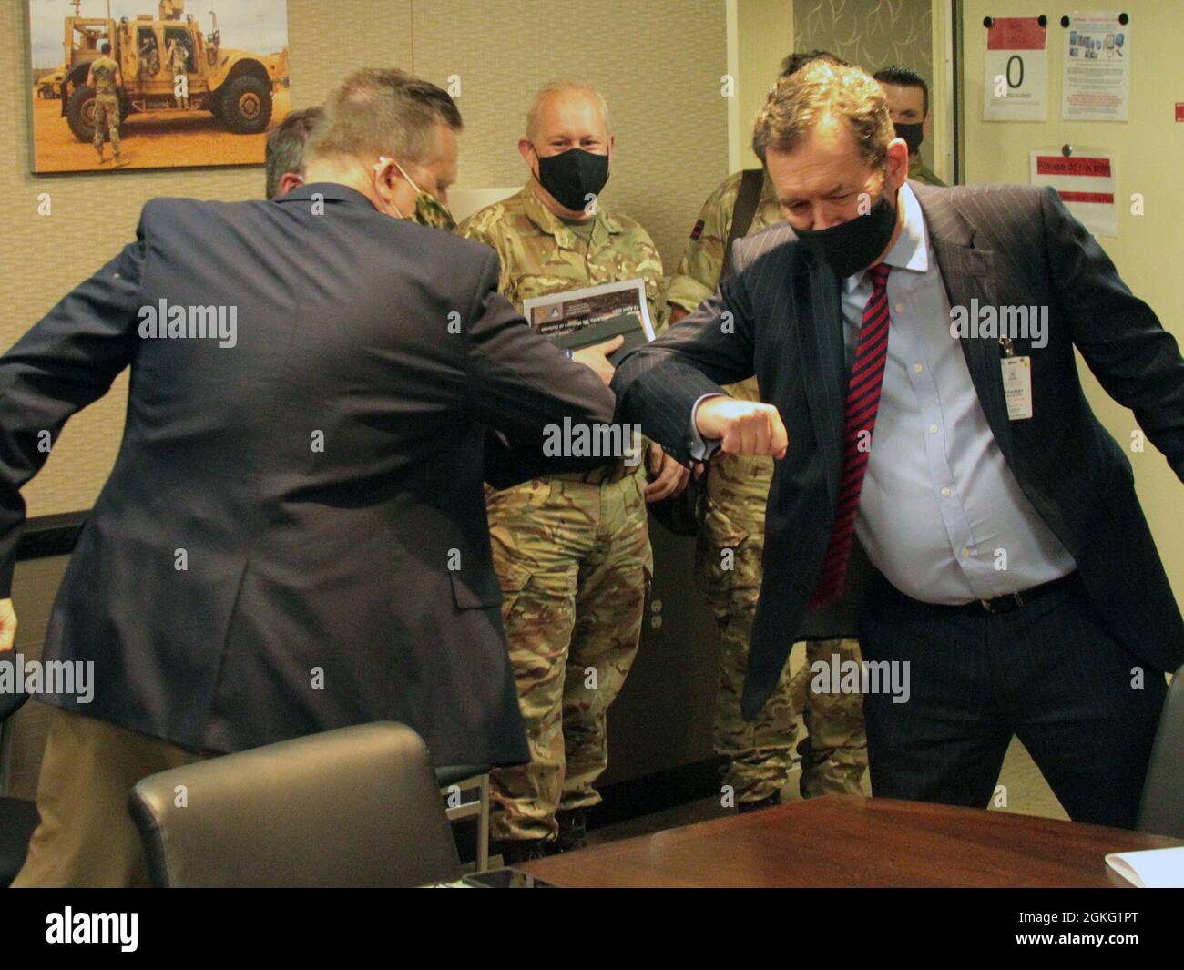 Michael Cadieux, Director Ground Vehicle Systems Center (left), greets ...